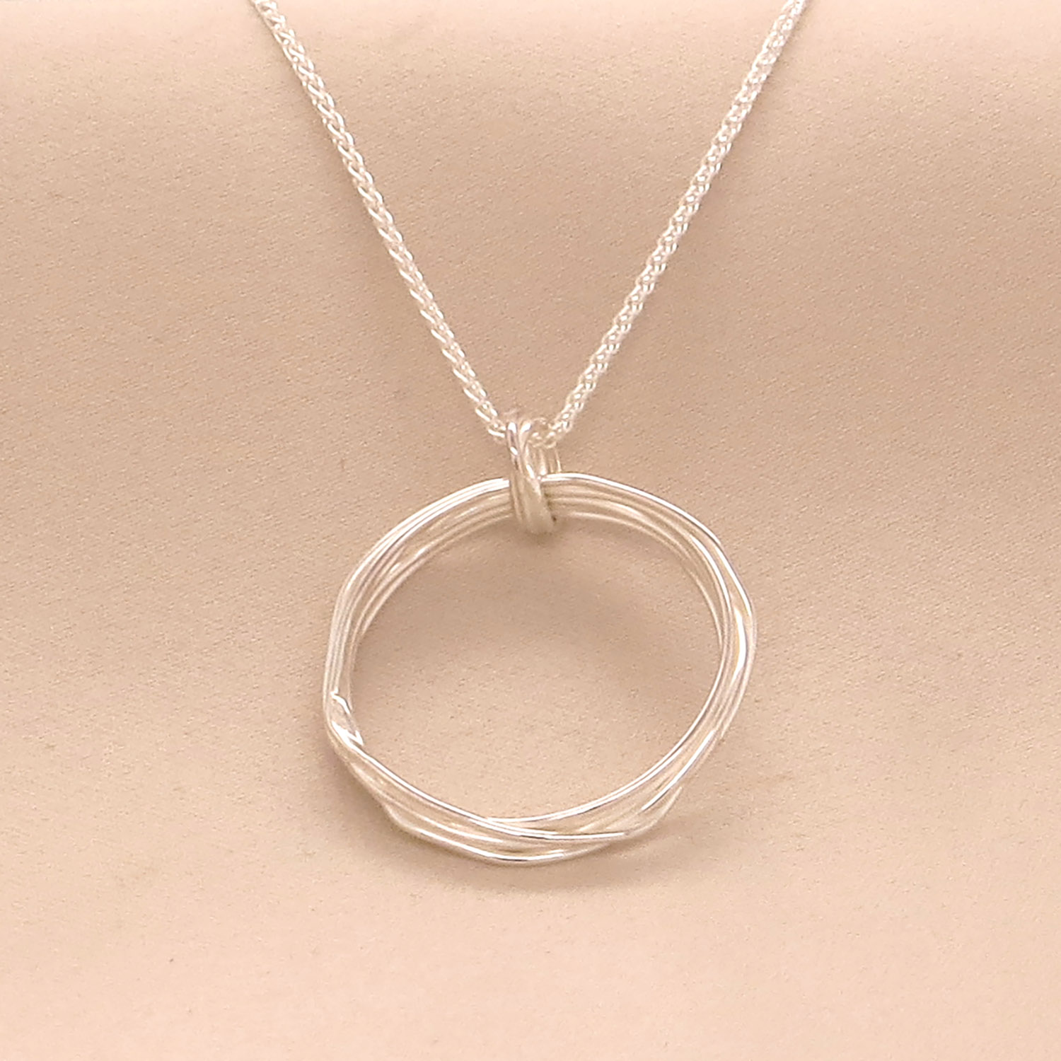 Contours continual round wire wrap pendant – Clarity